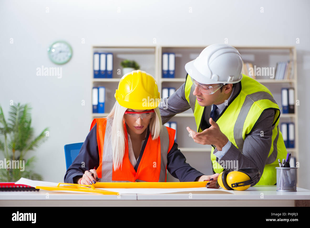 Construction workers having discussion in office before starting Stock ...