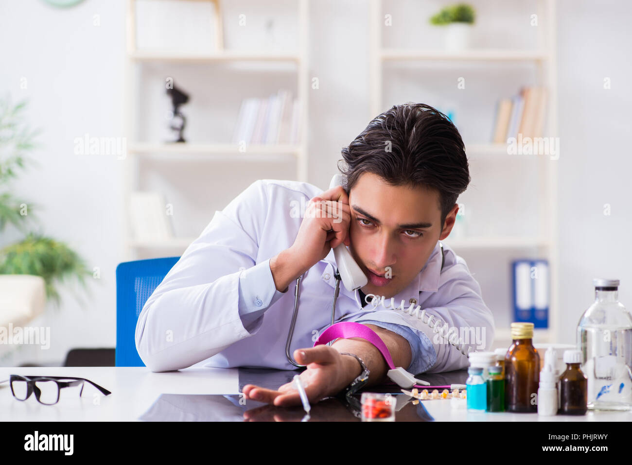 Doctor drug addict in the hospital Stock Photo - Alamy