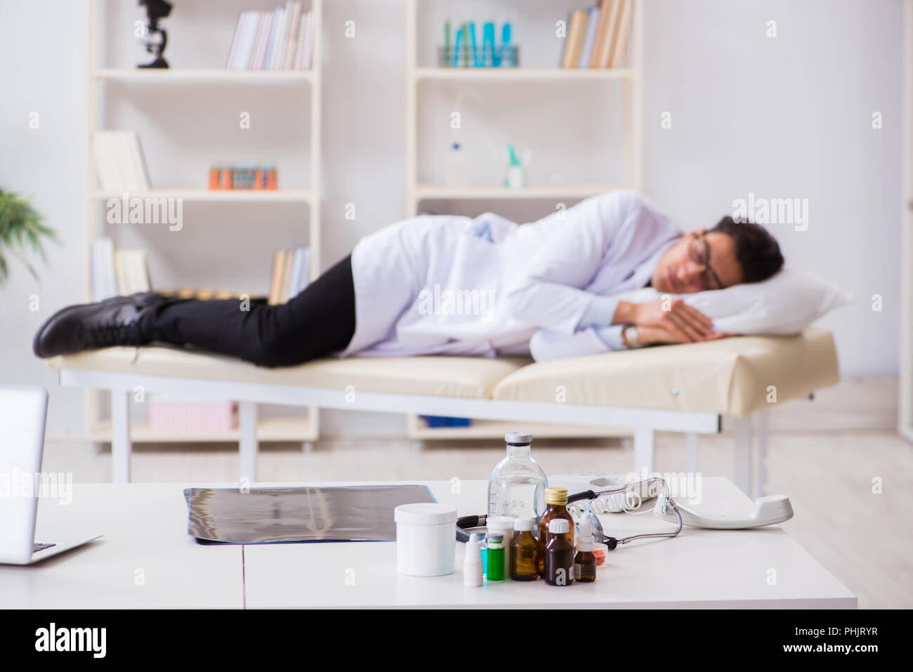 Doctor relaxing after complex surgery in hospital Stock Photo - Alamy