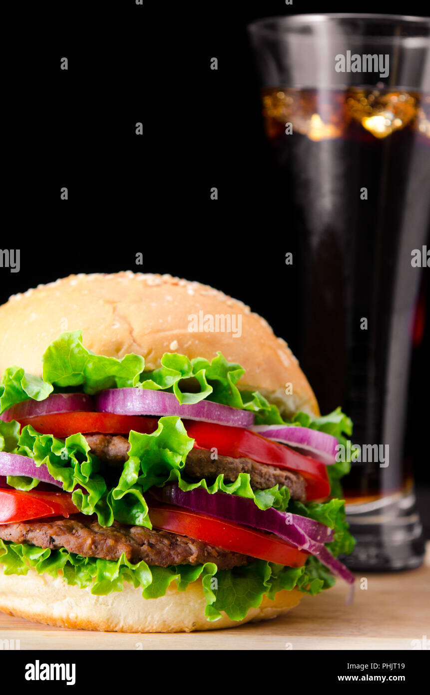 Burger served in bun in nutrition fast food concept Stock Photo - Alamy