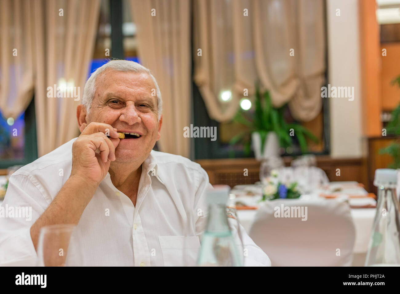 Old man eating bread hi-res stock photography and images - Alamy