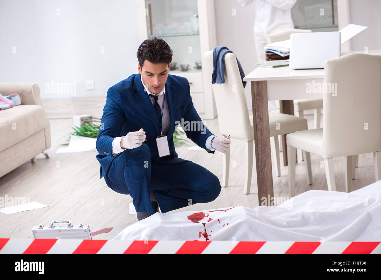 Forensics investigator at the scene of office crime Stock Photo - Alamy