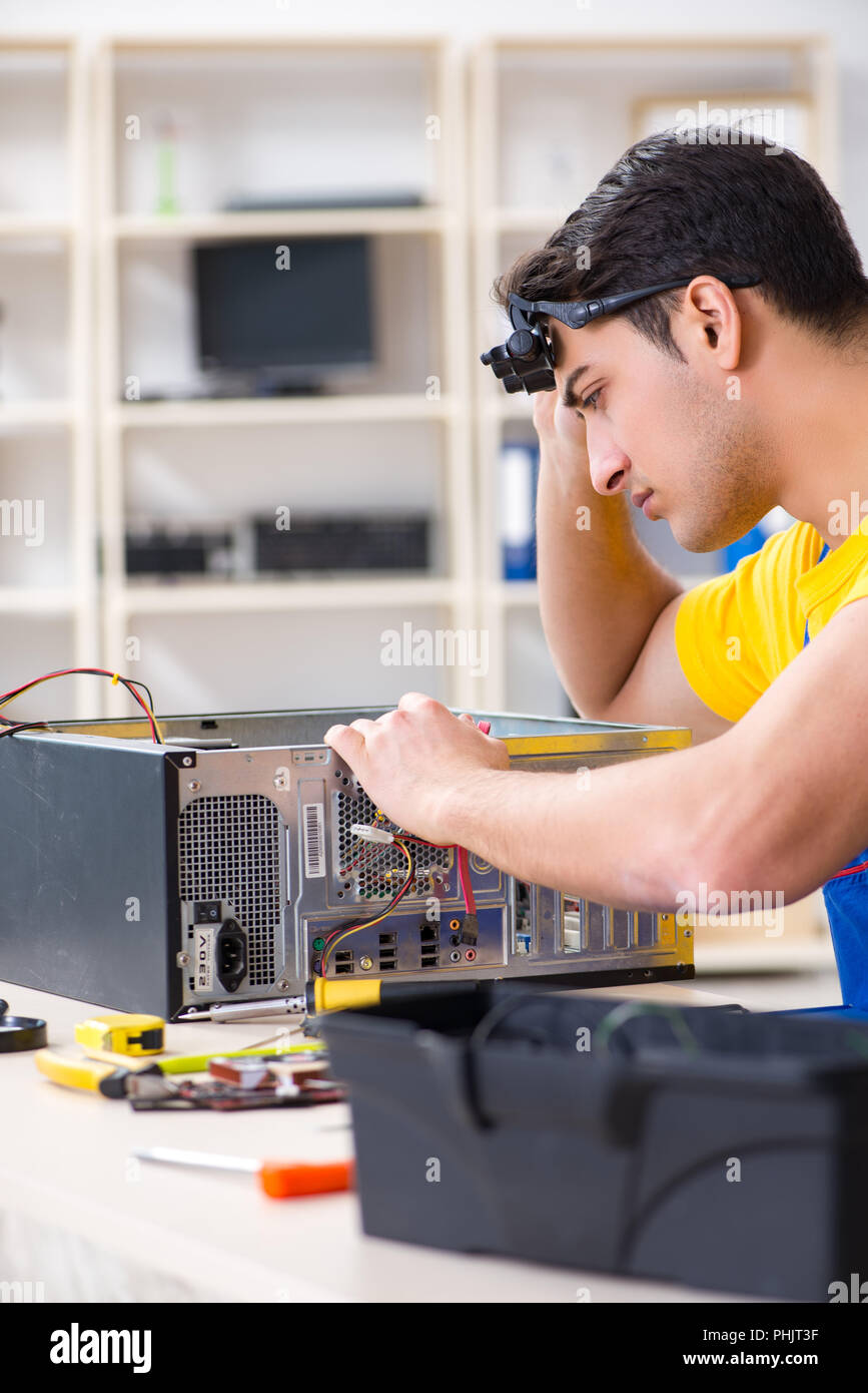 Computer repair technician repairing hardware Stock Photo - Alamy