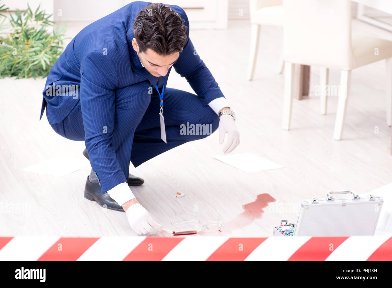 Forensics investigator at the scene of office crime Stock Photo - Alamy