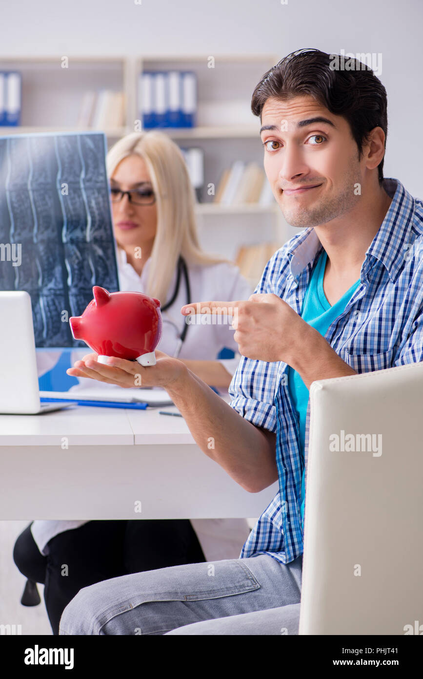 Male patient angry at expensive healthcare bill Stock Photo - Alamy