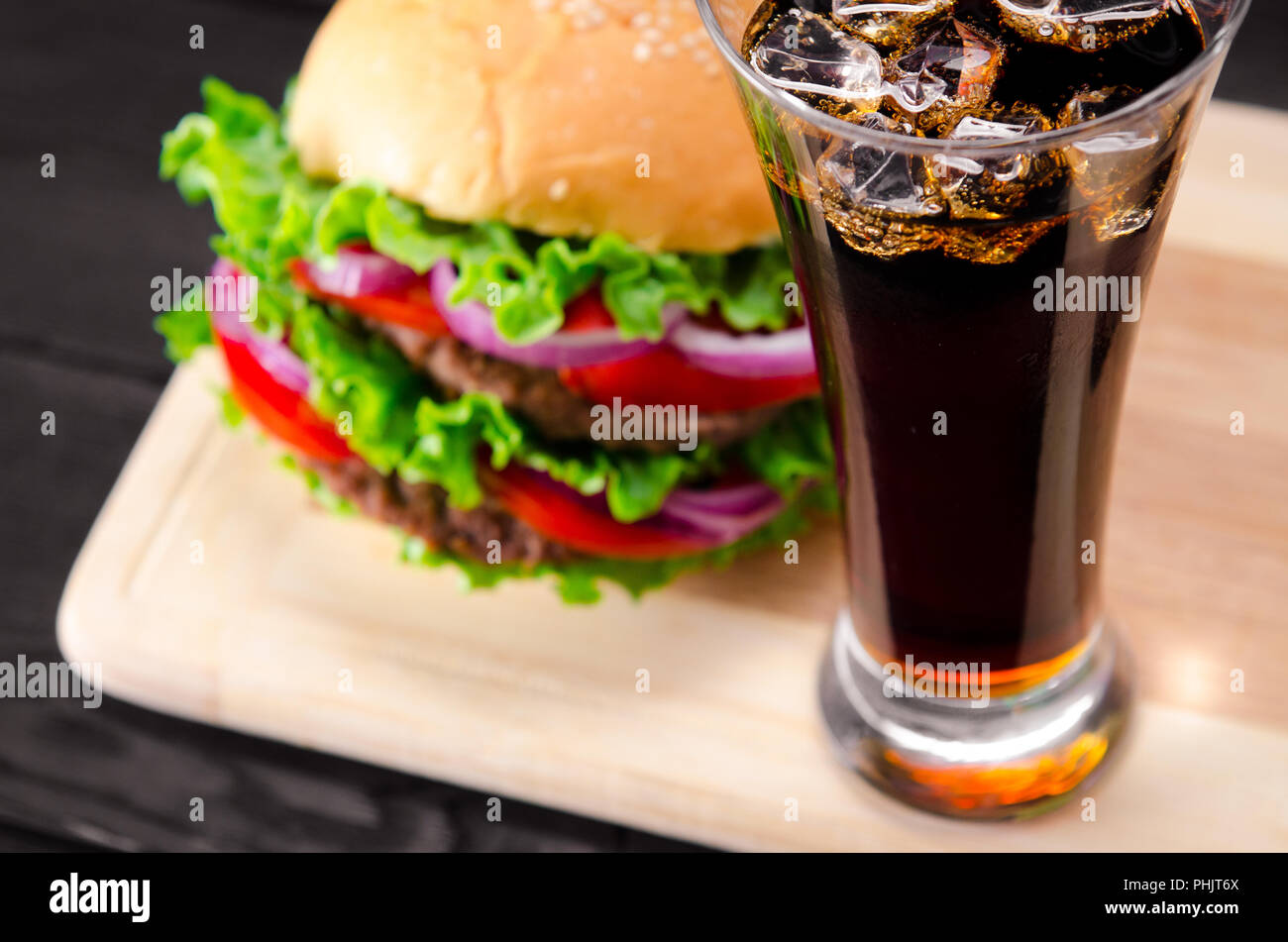 Burger served in bun in nutrition fast food concept Stock Photo - Alamy