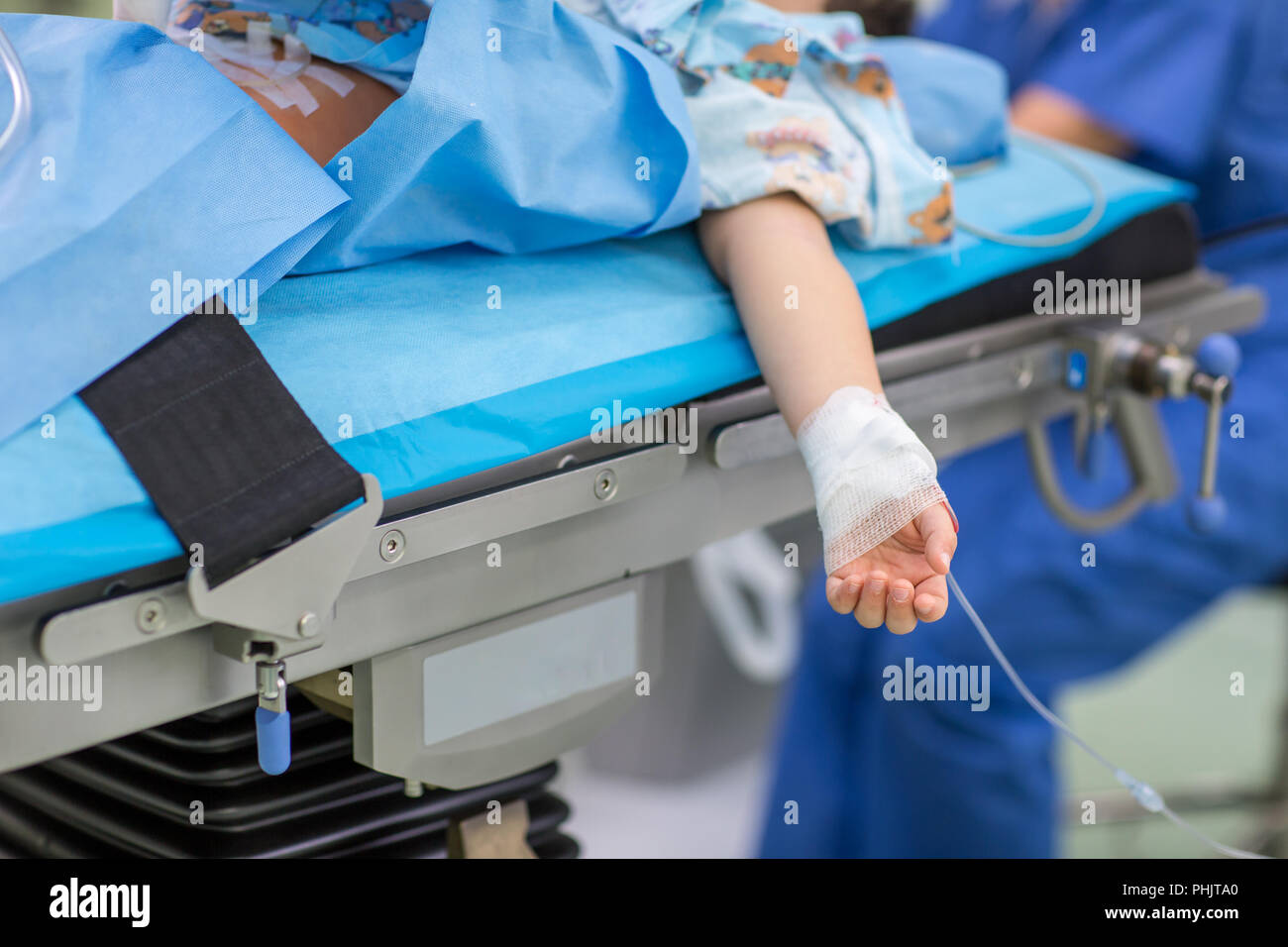 Unidentified child patient undergoing a surgery (no faces, shallow DOF ...
