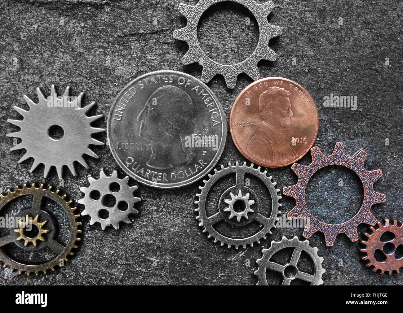 Coins and gears Stock Photo - Alamy