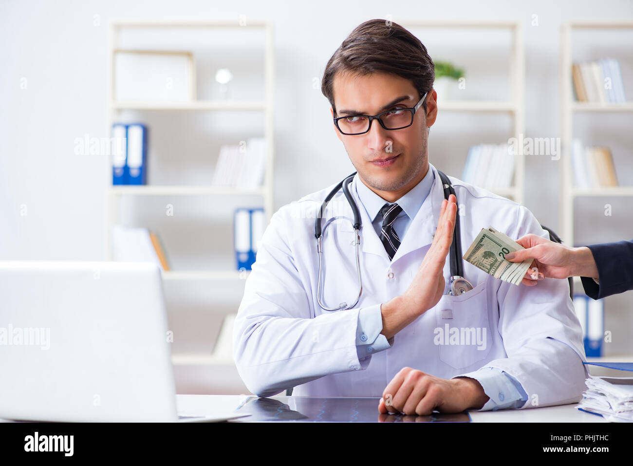 Doctor refusing cash payment hi-res stock photography and images - Alamy