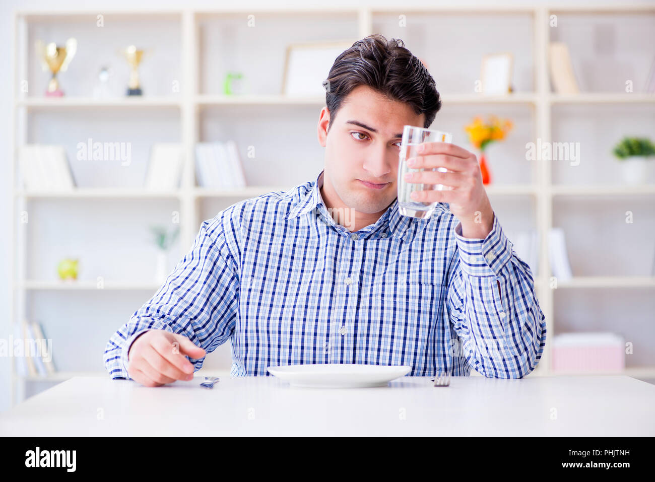 Man on diet waiting for food in restaurant Stock Photo - Alamy