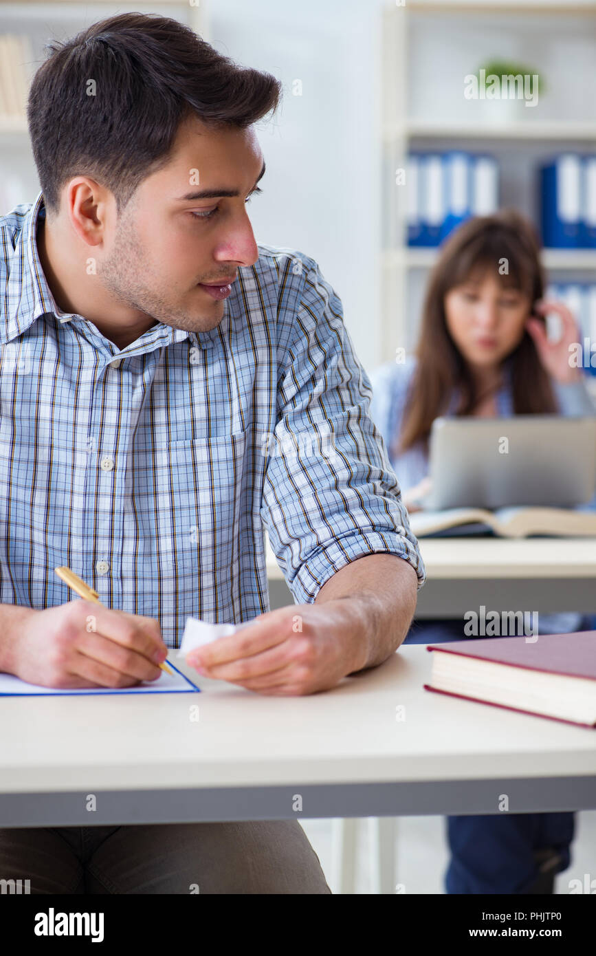 Students sitting and studying in classroom college Stock Photo - Alamy
