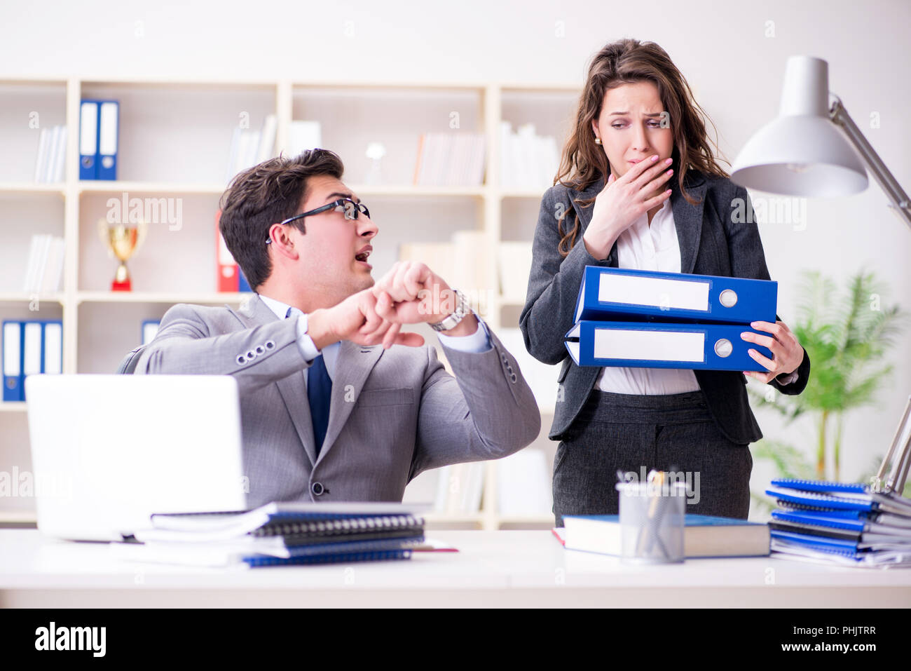 Angry boss unhappy with female employee performance Stock Photo - Alamy