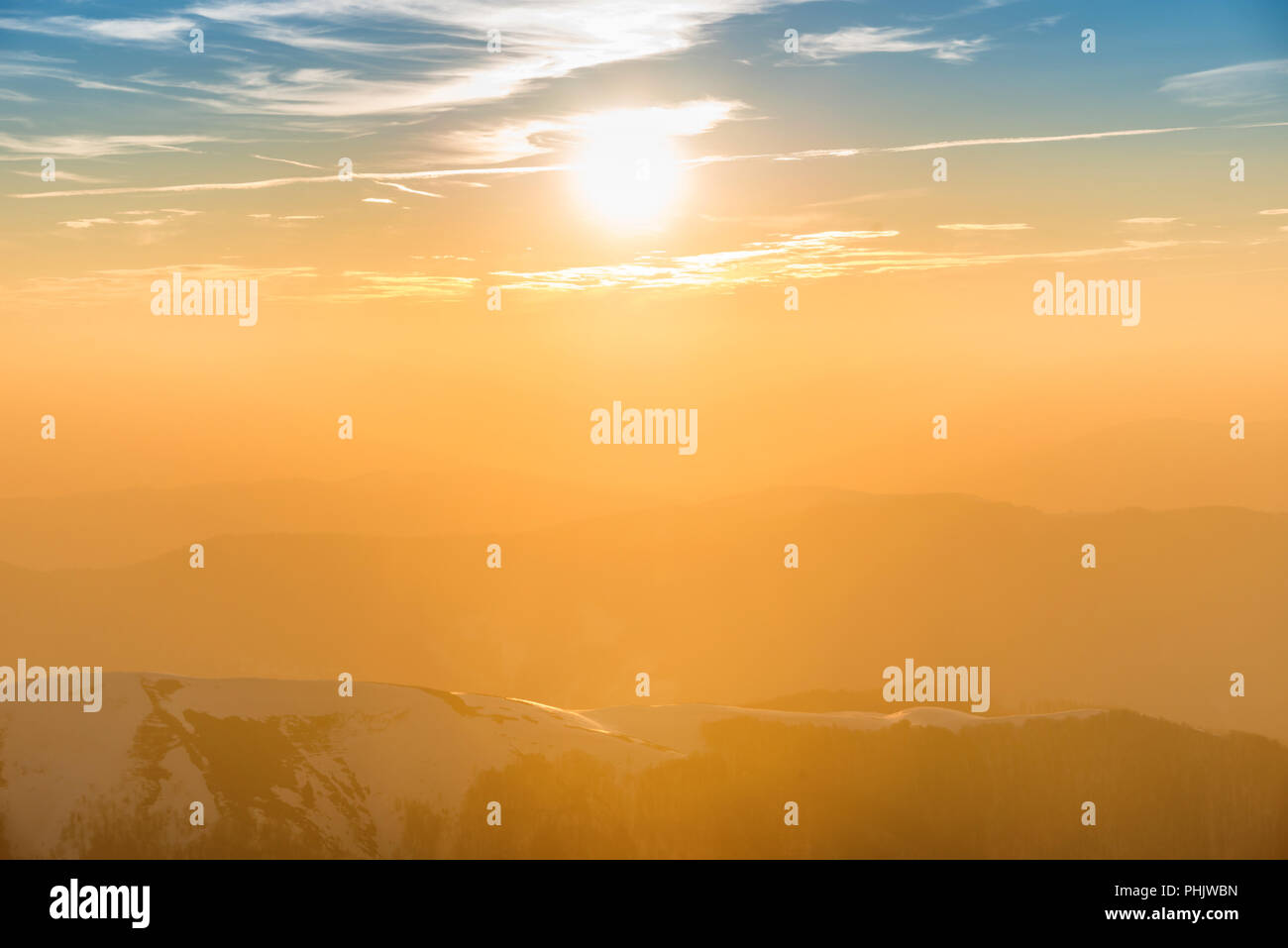 Beautiful sunset over snowy mountains hi-res stock photography and ...