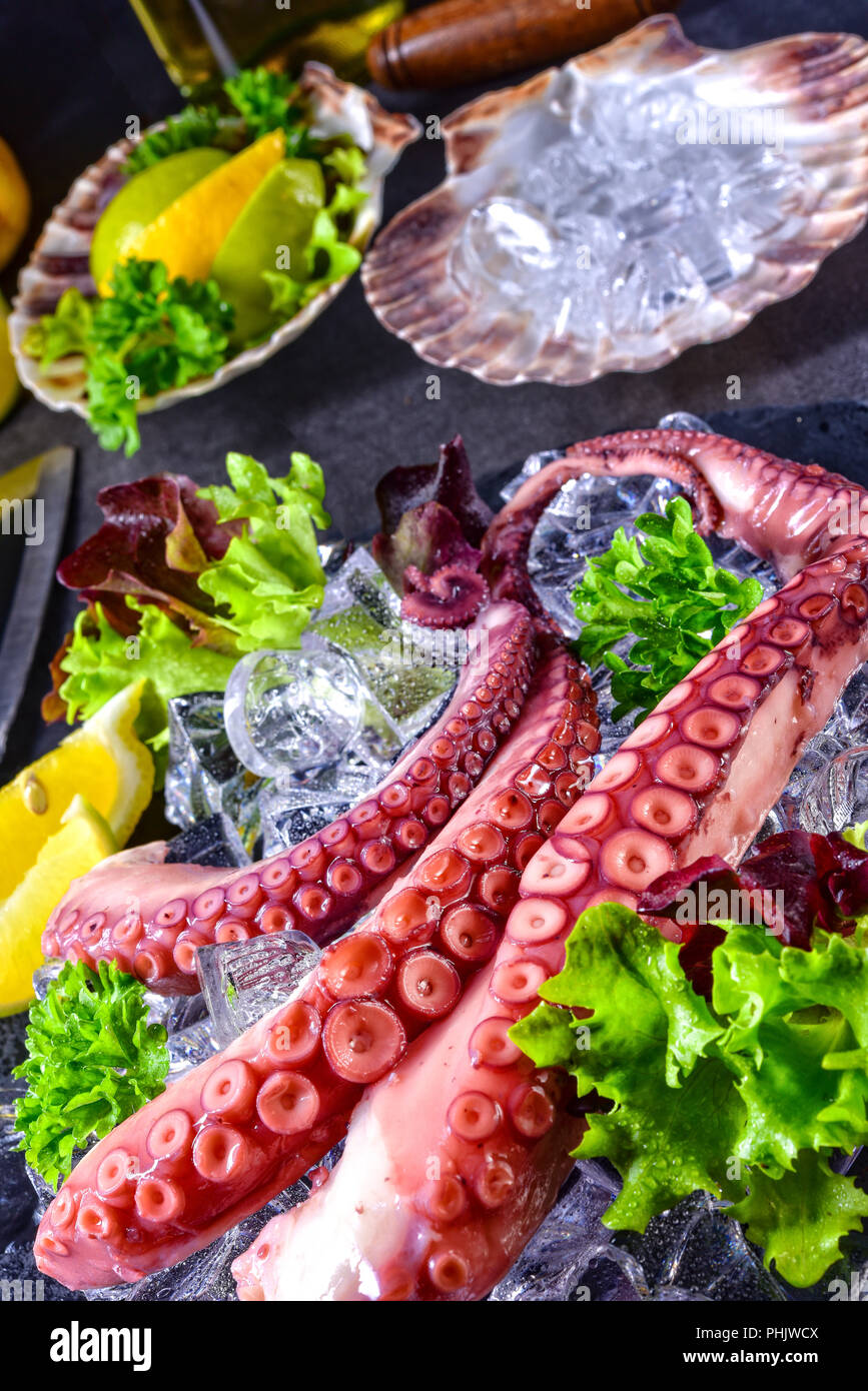 raw octopus on the ice Stock Photo - Alamy