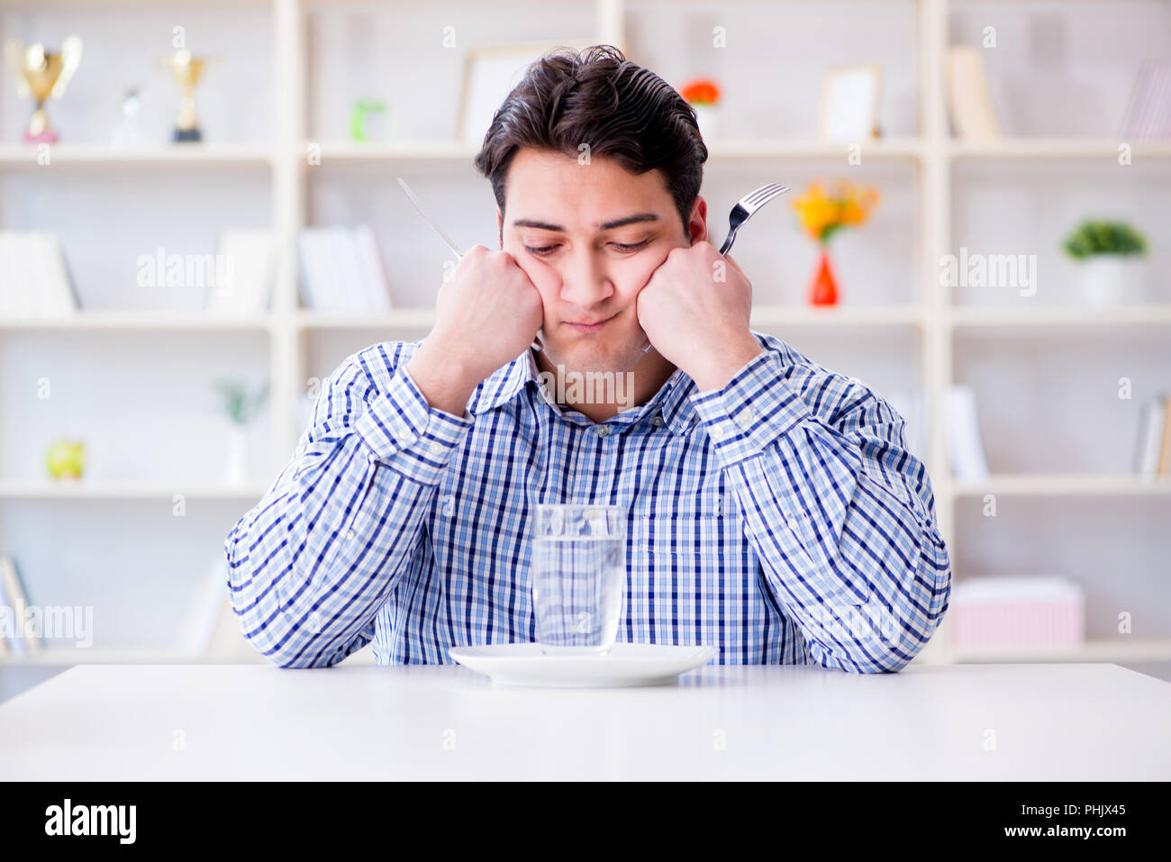 Man on diet waiting for food in restaurant Stock Photo - Alamy