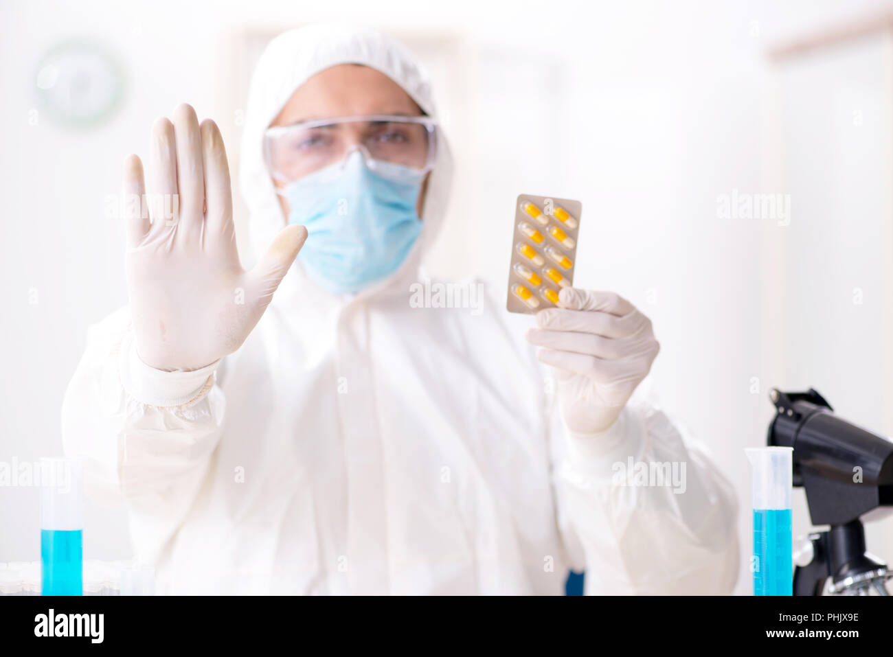 Lab assistant in drug synthesis concept Stock Photo - Alamy