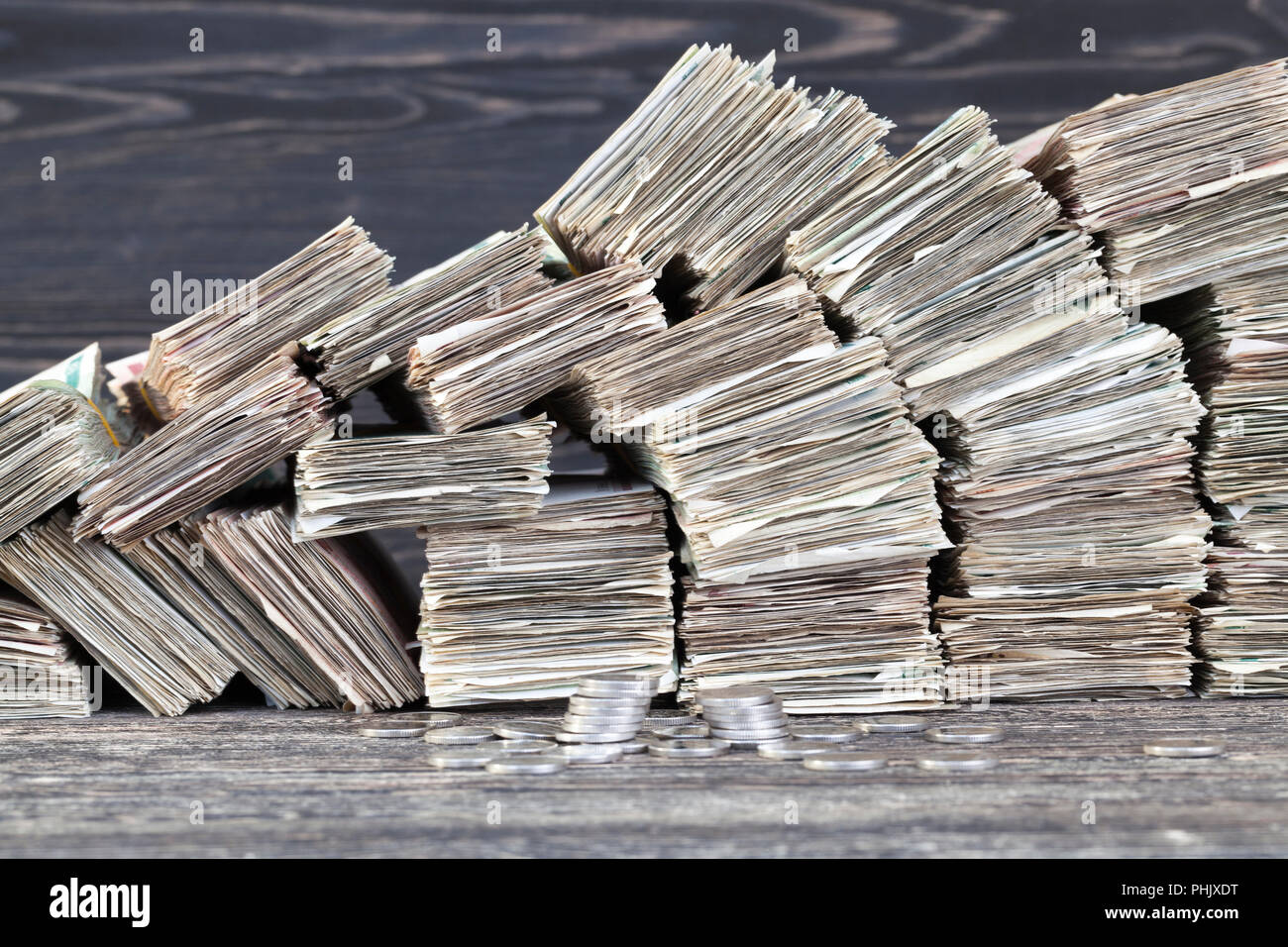 stacks of folded paper money worn and worn out, ready for disposal and ...