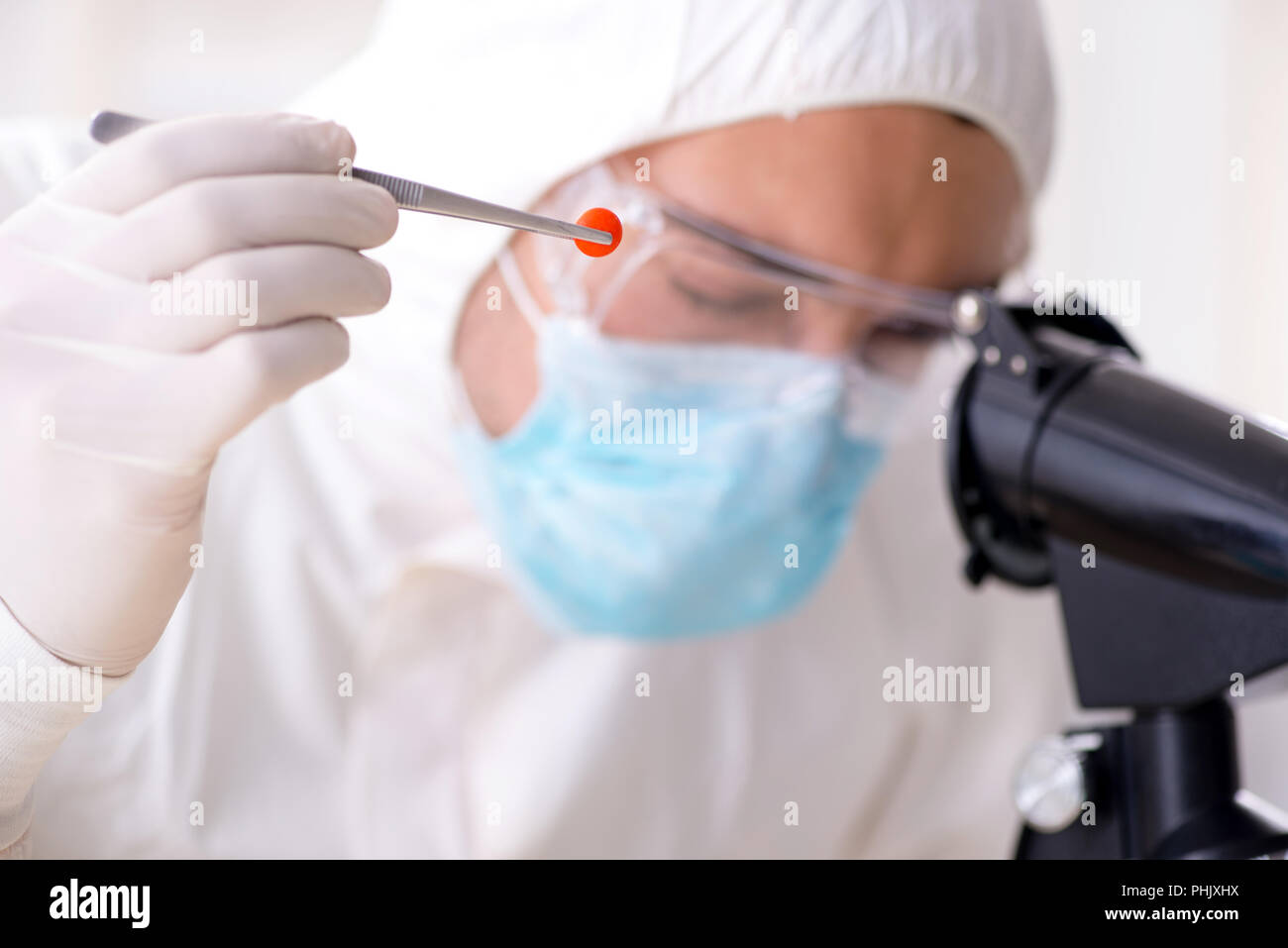 Lab assistant in drug synthesis concept Stock Photo - Alamy