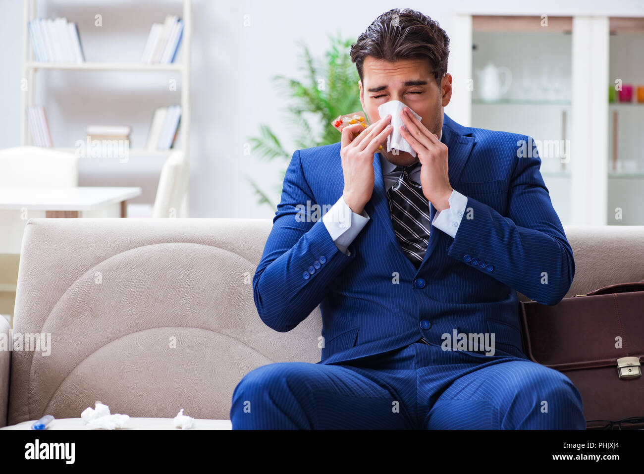 Sick employee staying at home suffering from flue Stock Photo - Alamy