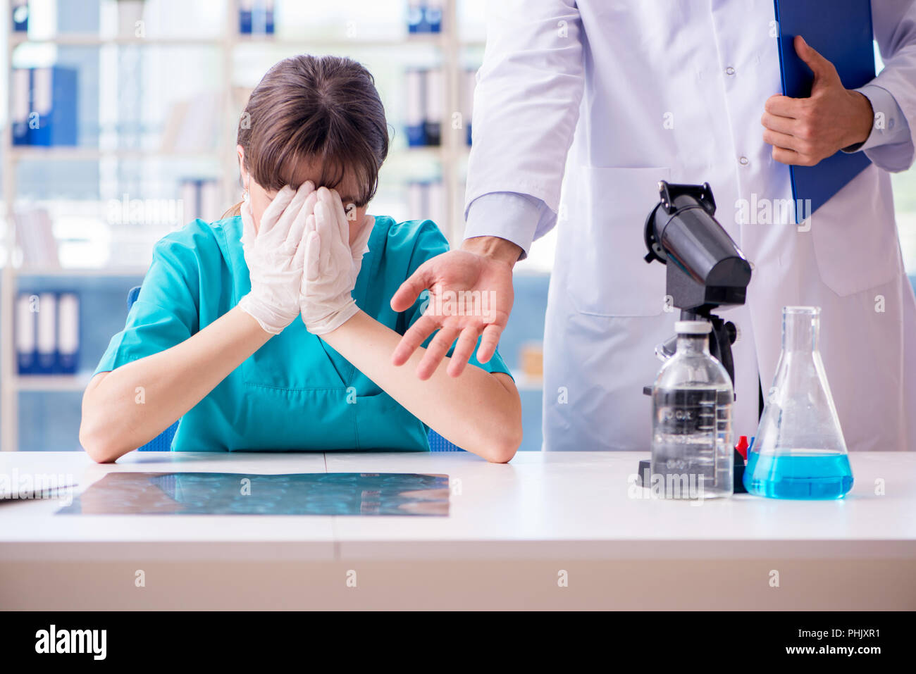 Doctor angry at his assistant due to medical error Stock Photo - Alamy