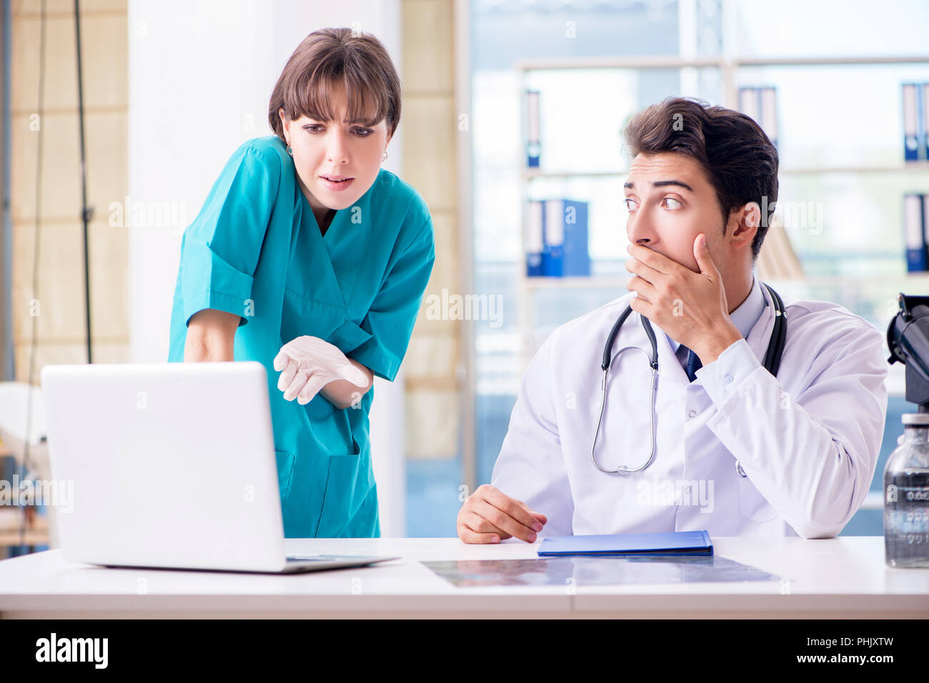 Doctor angry at his assistant due to medical error Stock Photo - Alamy