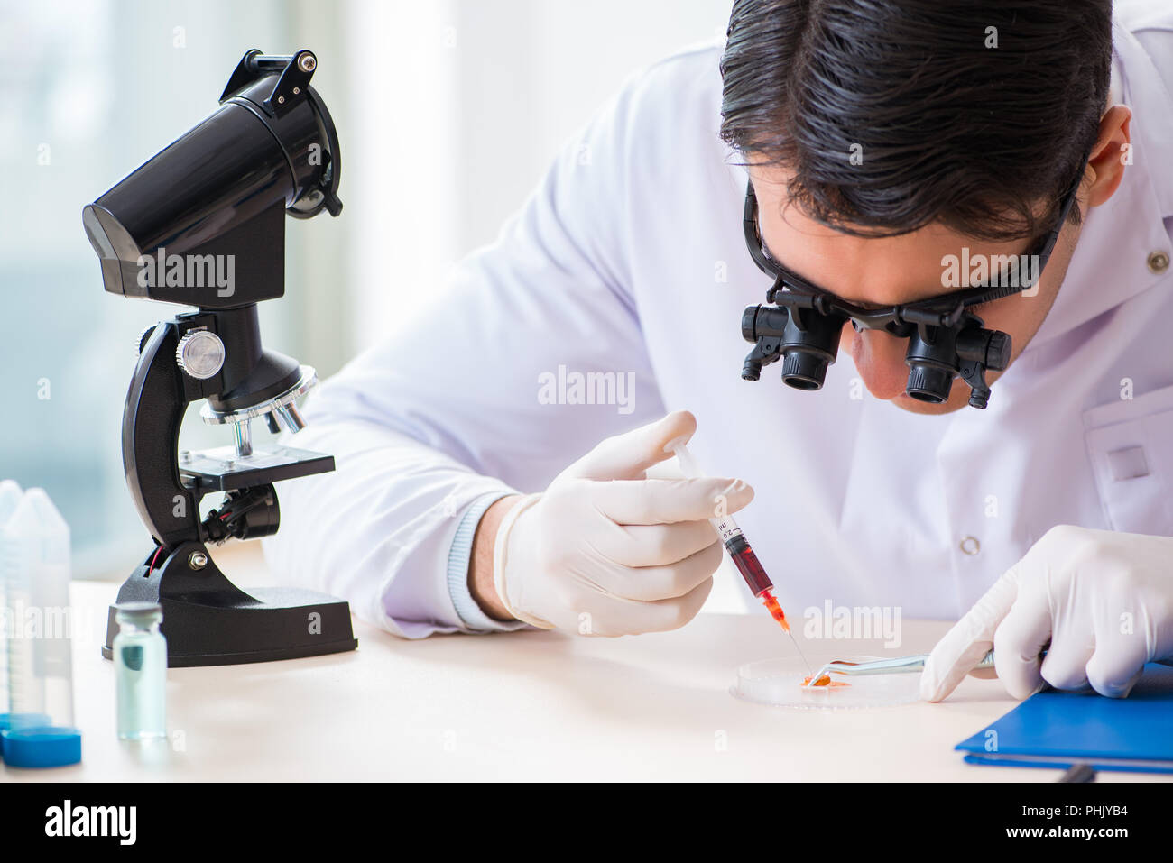 Doctor chemist working on blood samples in lab Stock Photo - Alamy