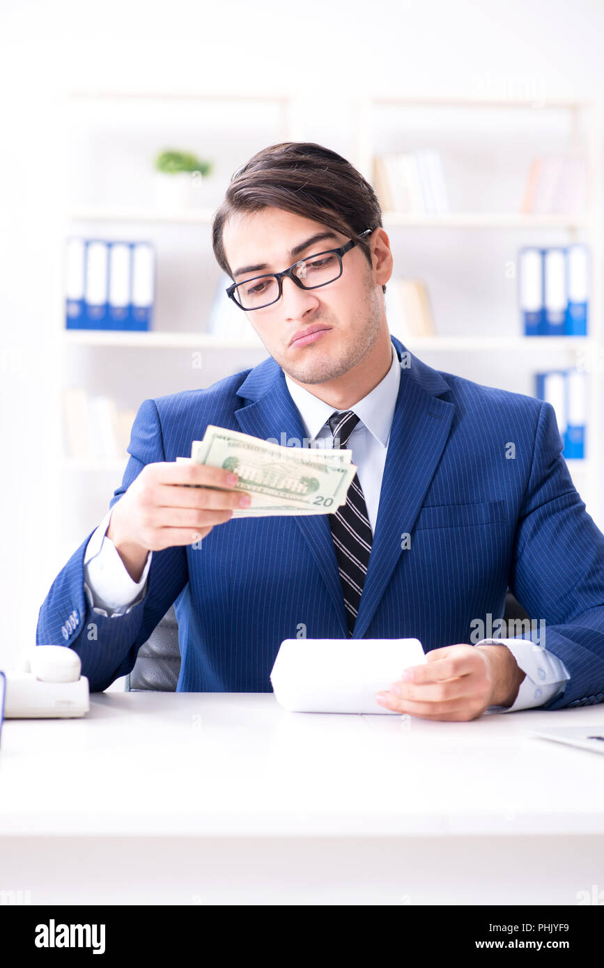 Businessman receiving his salary and bonus Stock Photo - Alamy