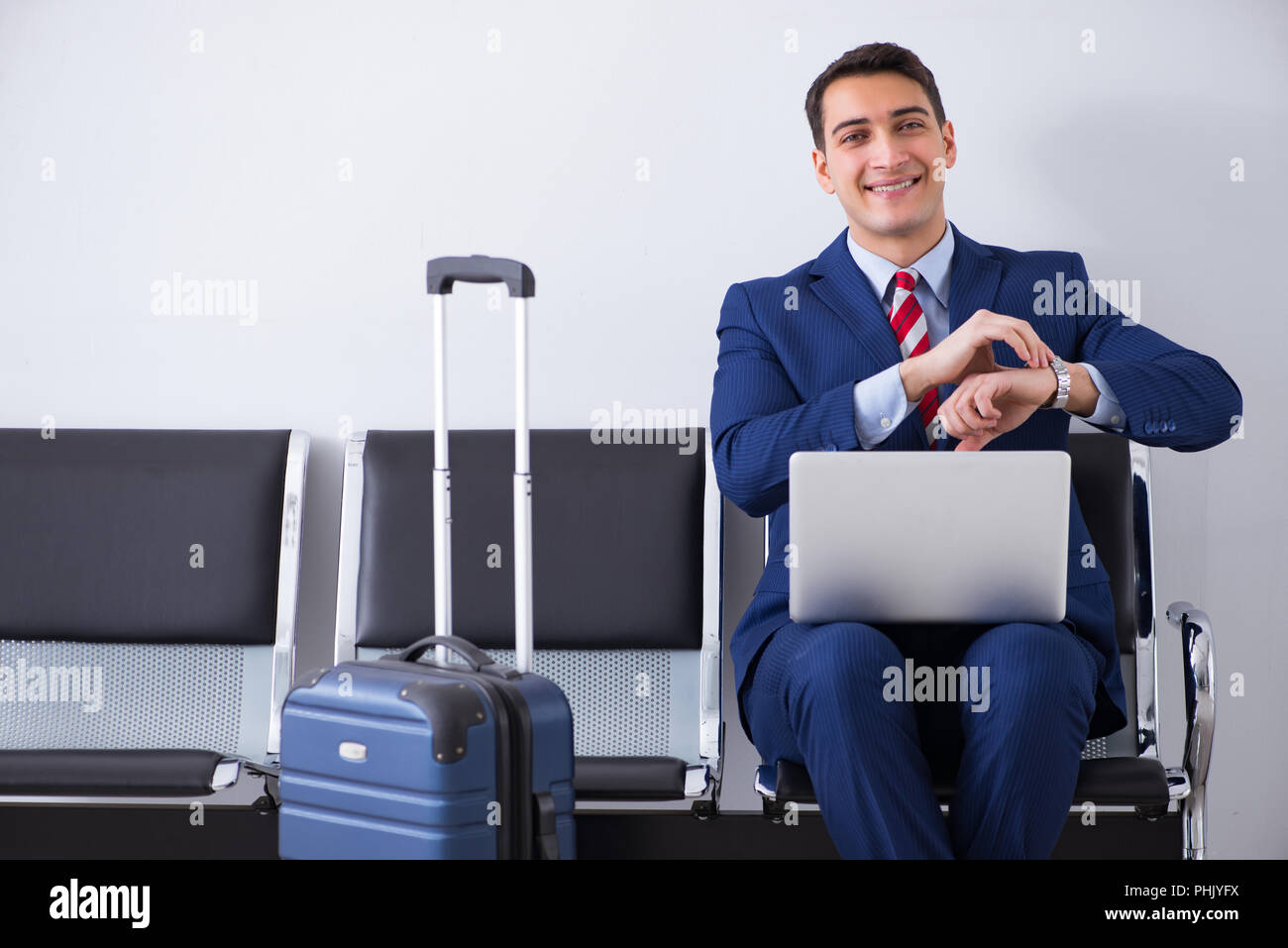 Man wairing to boarding in airport lounge room Stock Photo - Alamy