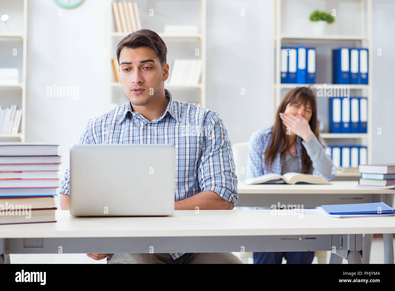 Students sitting and studying in classroom college Stock Photo - Alamy