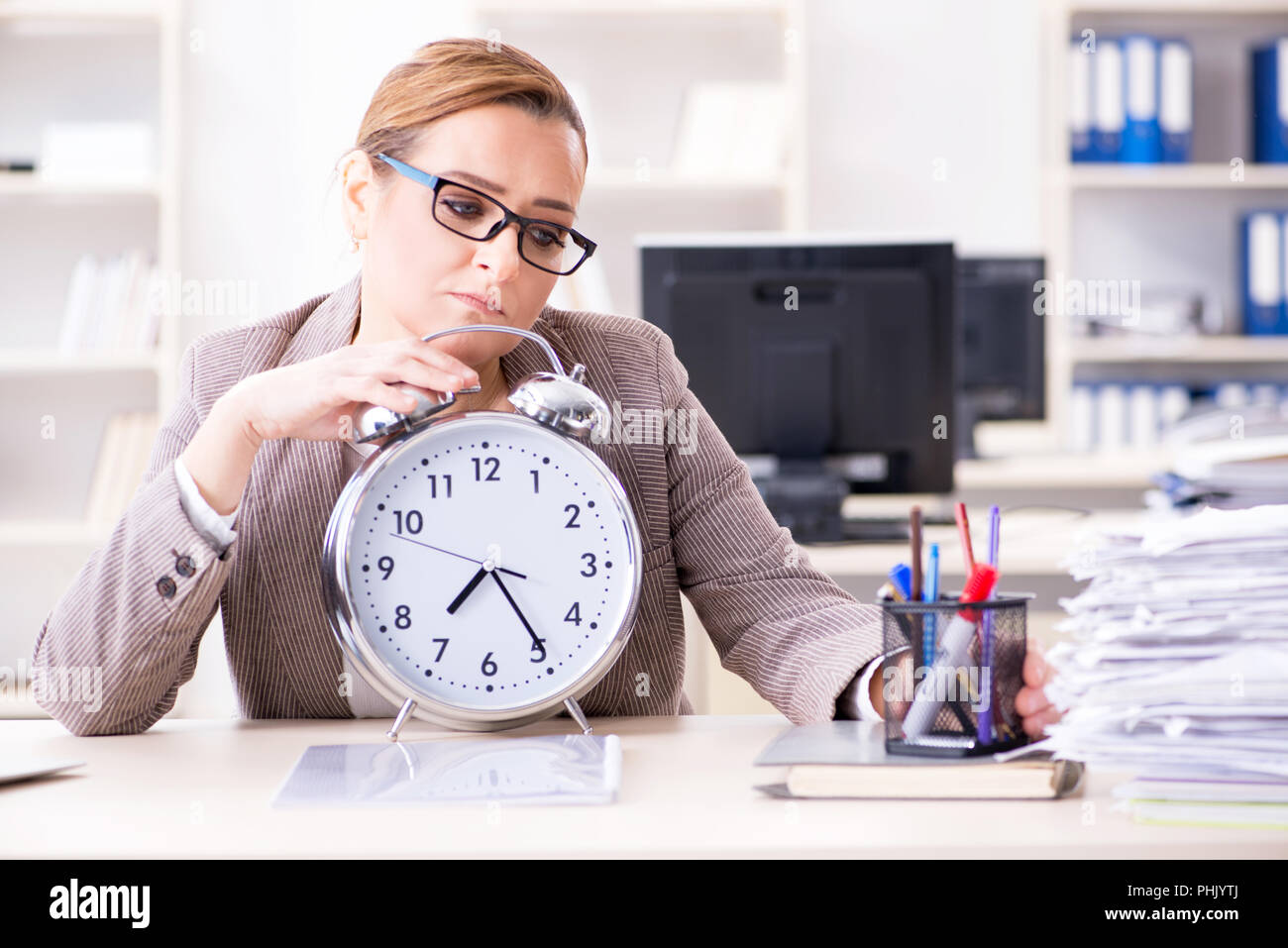 Businesswoman workaholic trying to finish urgent paperwork Stock Photo ...