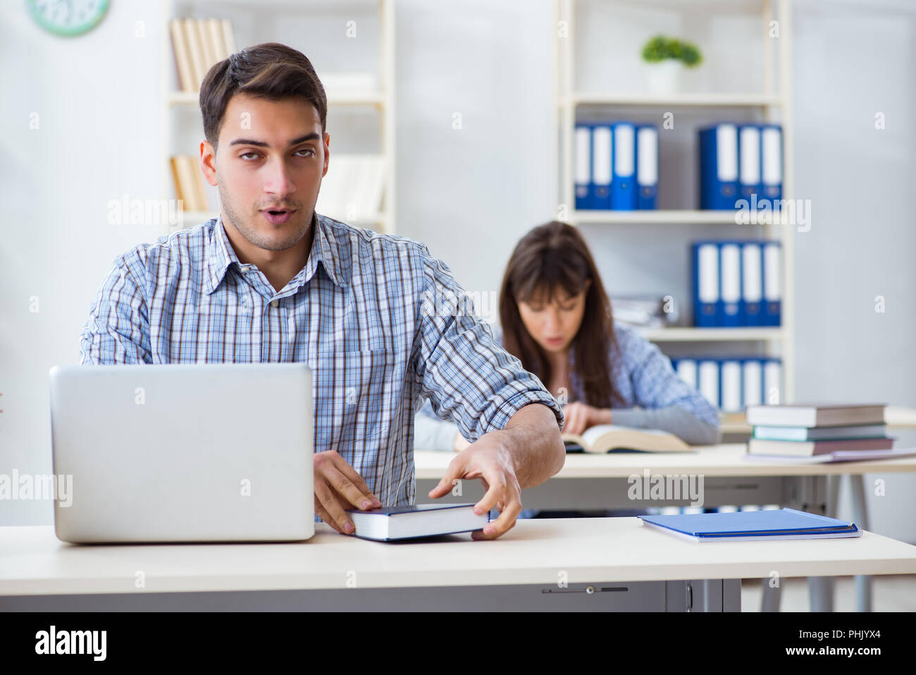 Students sitting and studying in classroom college Stock Photo - Alamy