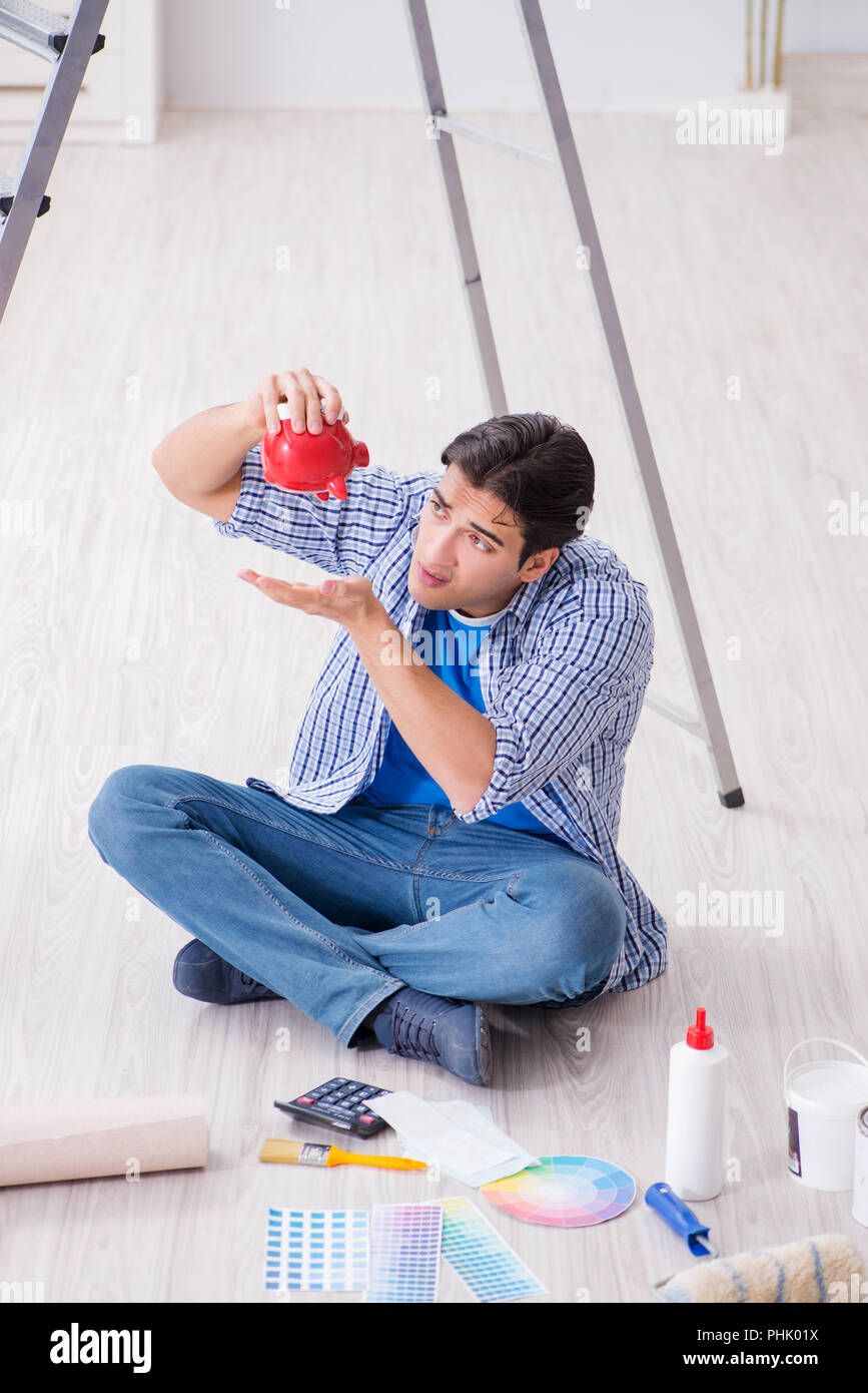 Young man overspending his budget in refurbishment project Stock Photo ...