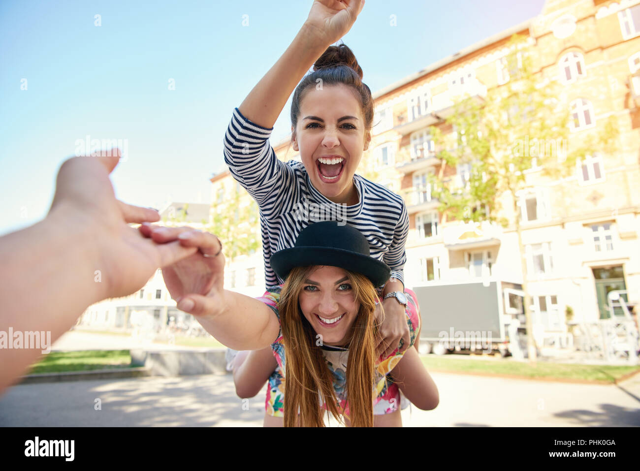 Carrying a friend on shoulders hi-res stock photography and images - Alamy