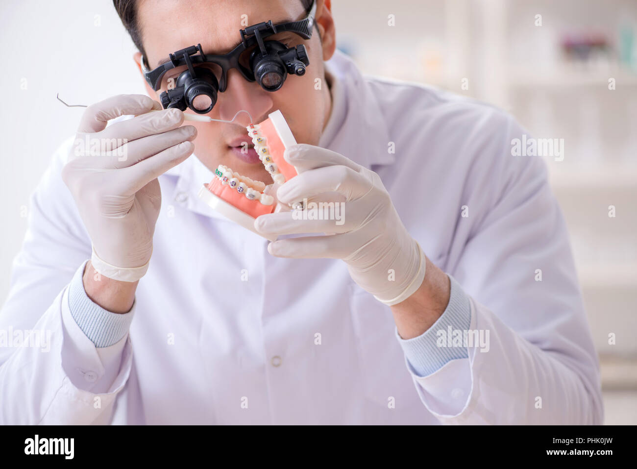 Young dentist working in the dentistry hospital Stock Photo - Alamy