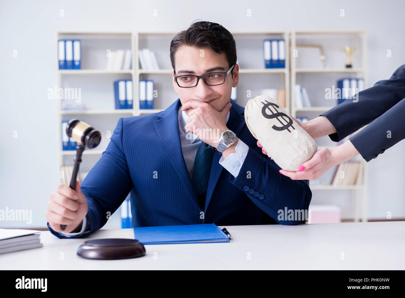 Judge in bribe concept with money Stock Photo - Alamy