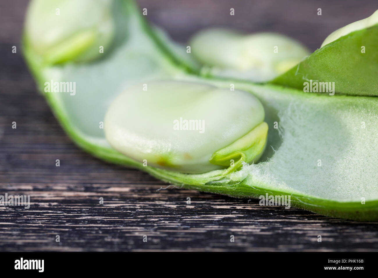 open green ripe bean from green pod and white inside Stock Photo - Alamy