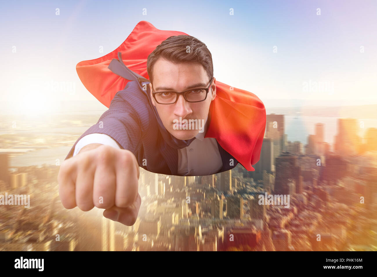 Flying super hero over the city Stock Photo - Alamy