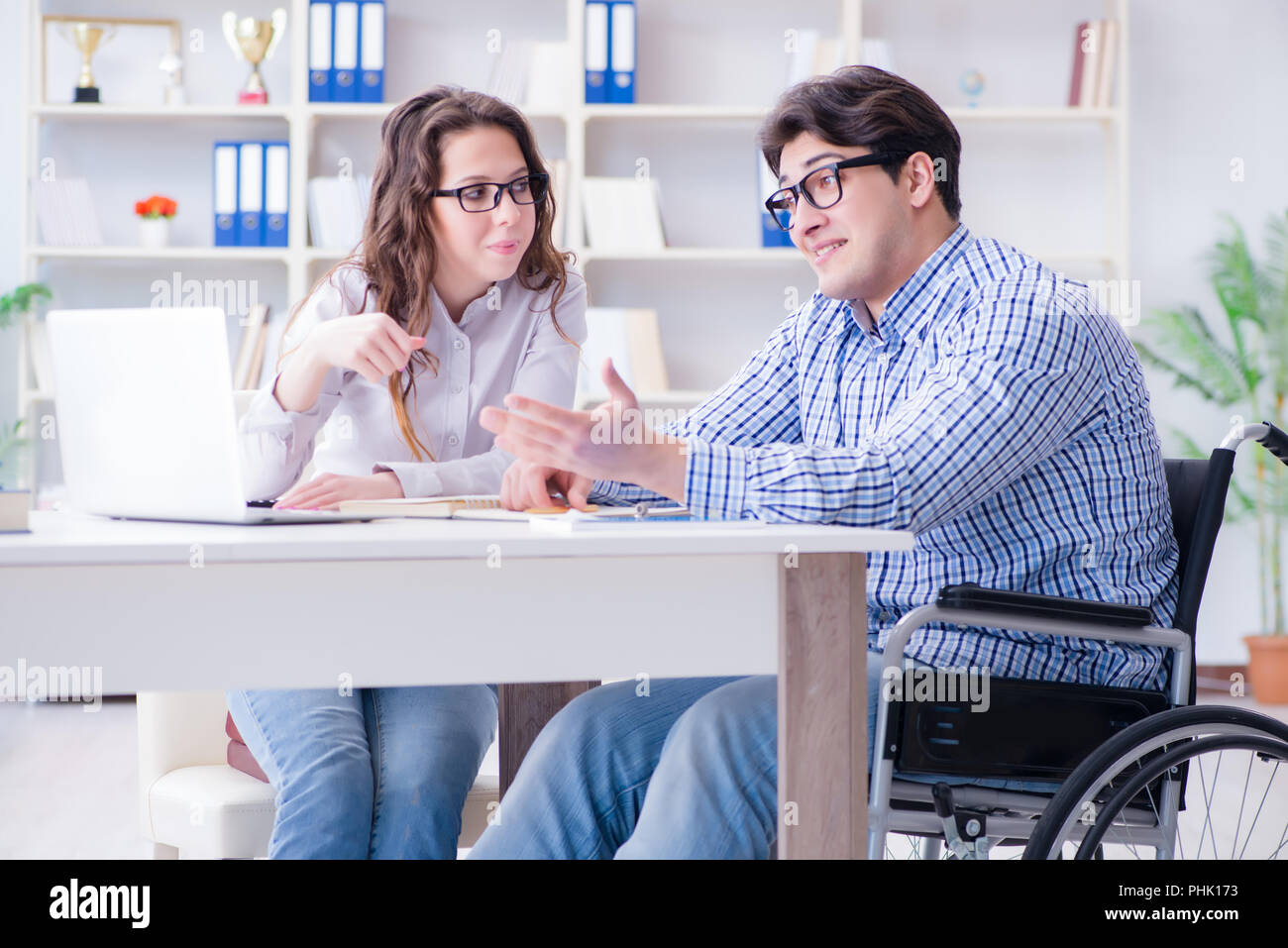 Disabled student studying and preparing for college exams Stock Photo ...