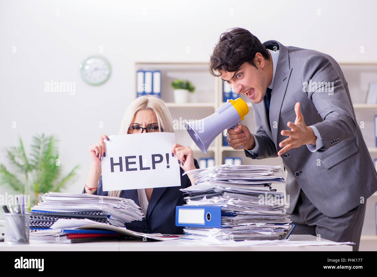 Angry boss yelling at his assistant secretary hi-res stock photography ...
