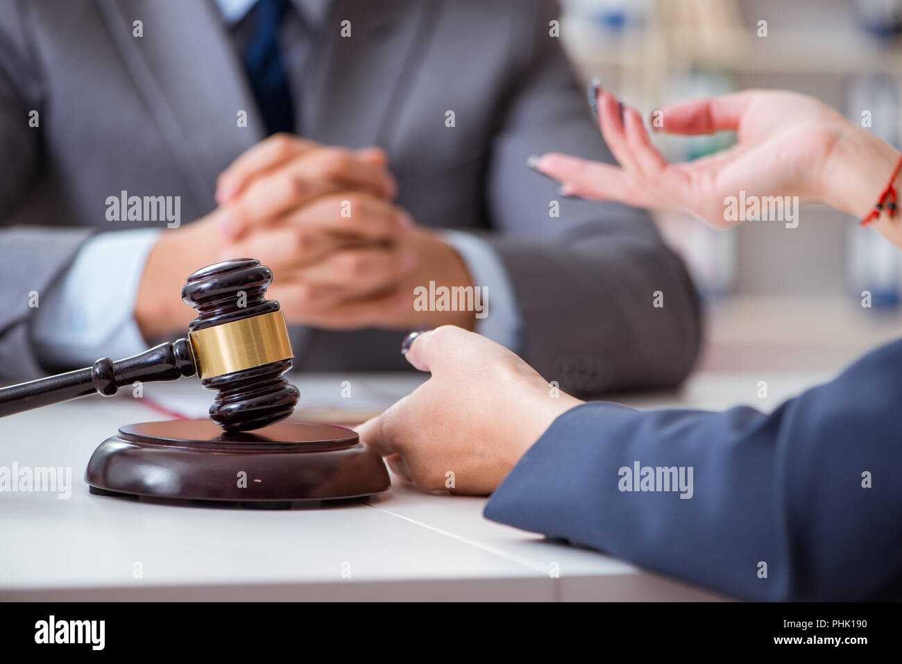 Lawyer discussing legal case with client Stock Photo - Alamy