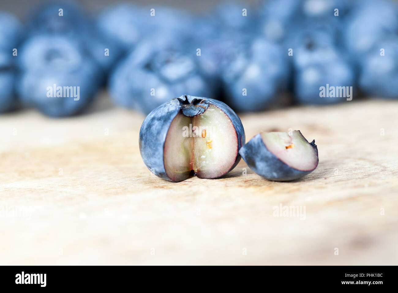 cut into pieces of ripe blueberry berries during the preparation of ...