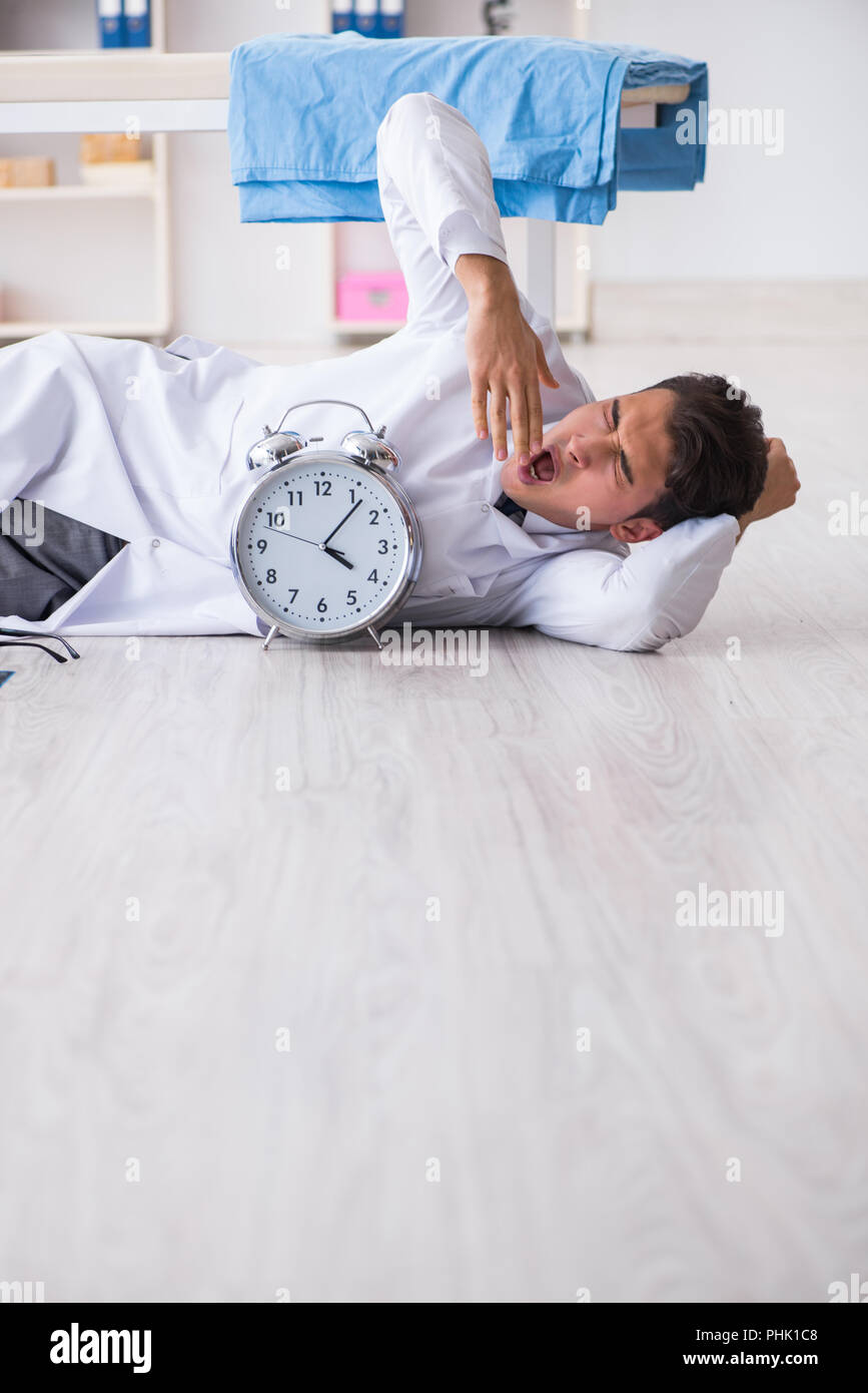 Sleepy doctor tired after long night shift Stock Photo - Alamy