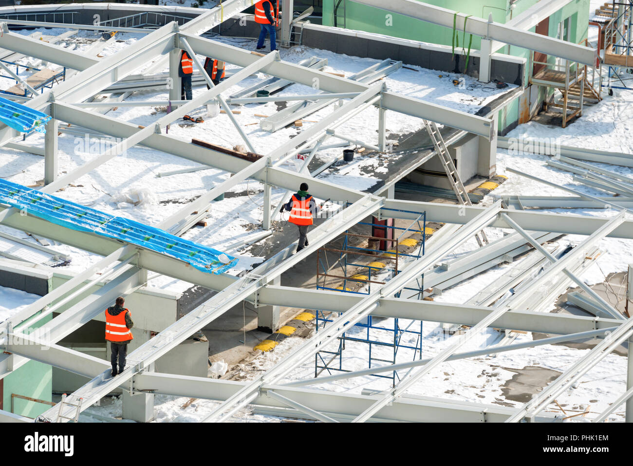 Workers on the building roof Stock Photo - Alamy