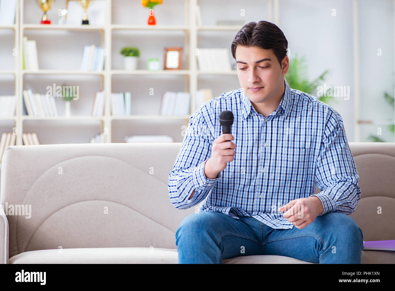Funny man singing songs in karaoke at home Stock Photo - Alamy