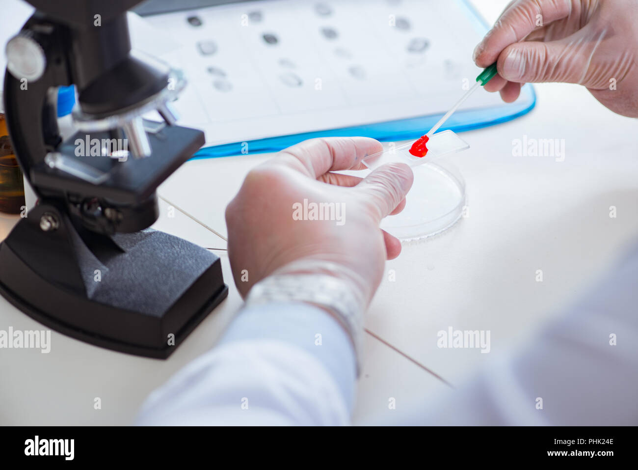 Drug synthesis lab experimentnig with pills Stock Photo - Alamy