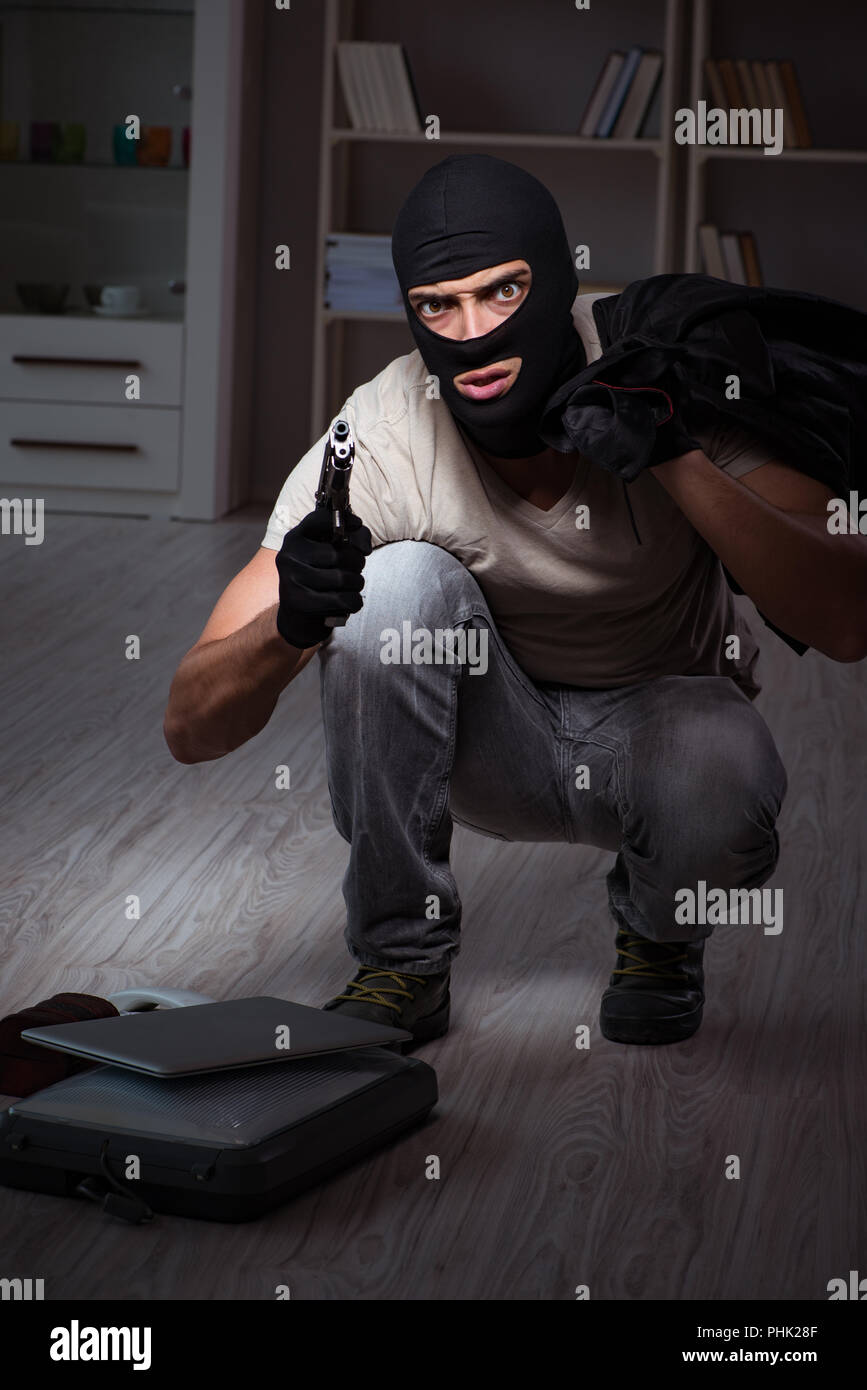 Burglar wearing balaclava mask at crime scene Stock Photo - Alamy