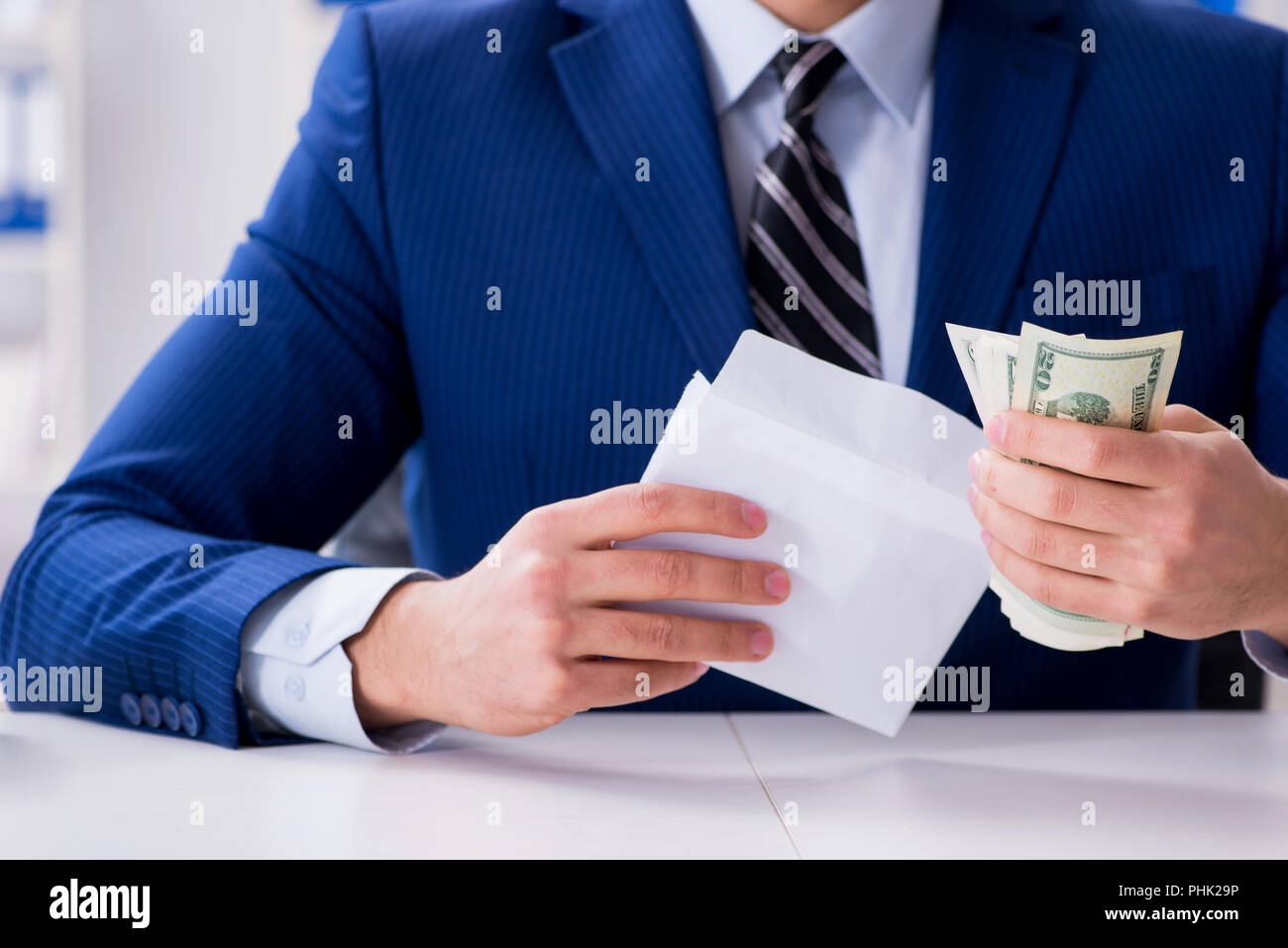 Businessman receiving his salary and bonus Stock Photo - Alamy