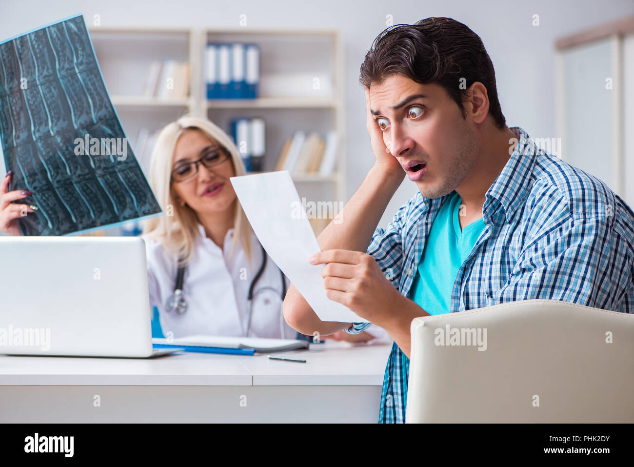 Male patient angry at expensive healthcare bill Stock Photo - Alamy