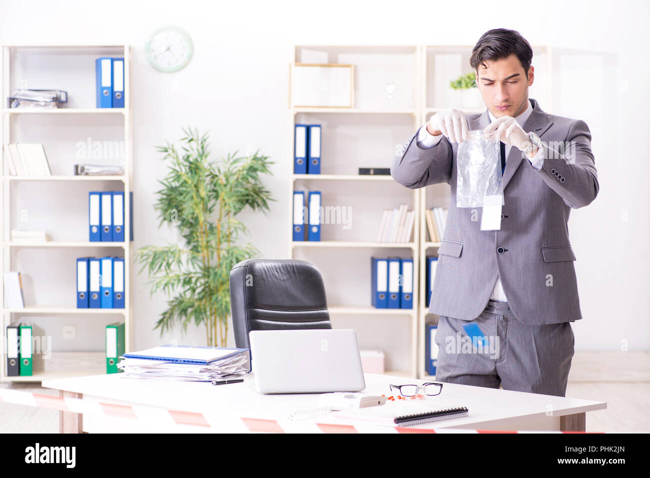 Forensics investigator at the scene of office crime Stock Photo - Alamy