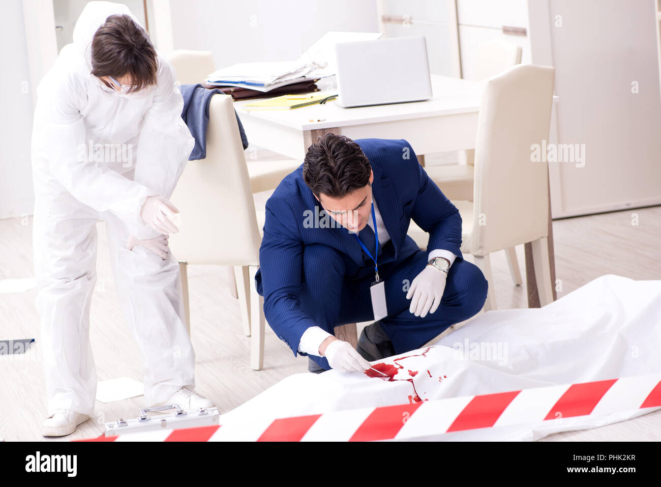 Forensics investigator at the scene of office crime Stock Photo - Alamy
